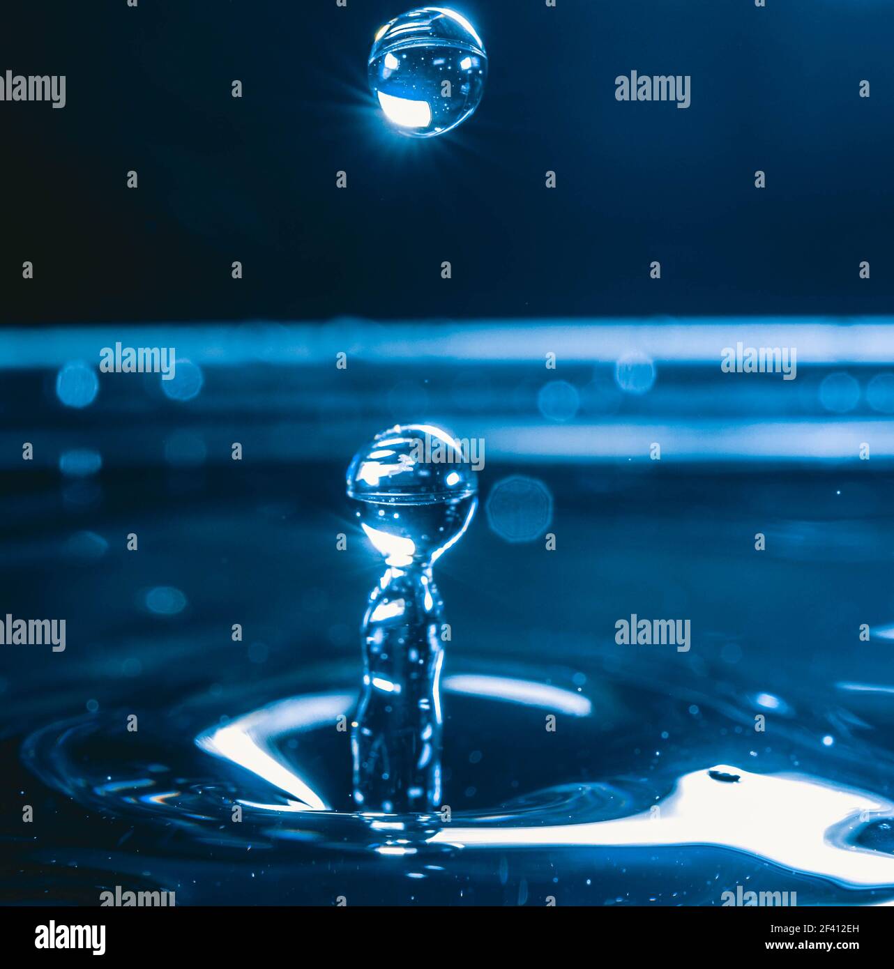 Colored water drop, circle ripples, splash of water, closeup Stock ...