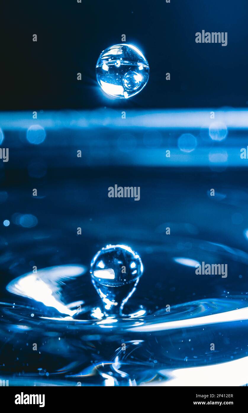 Colored water drop, circle ripples, splash of water, closeup Stock ...