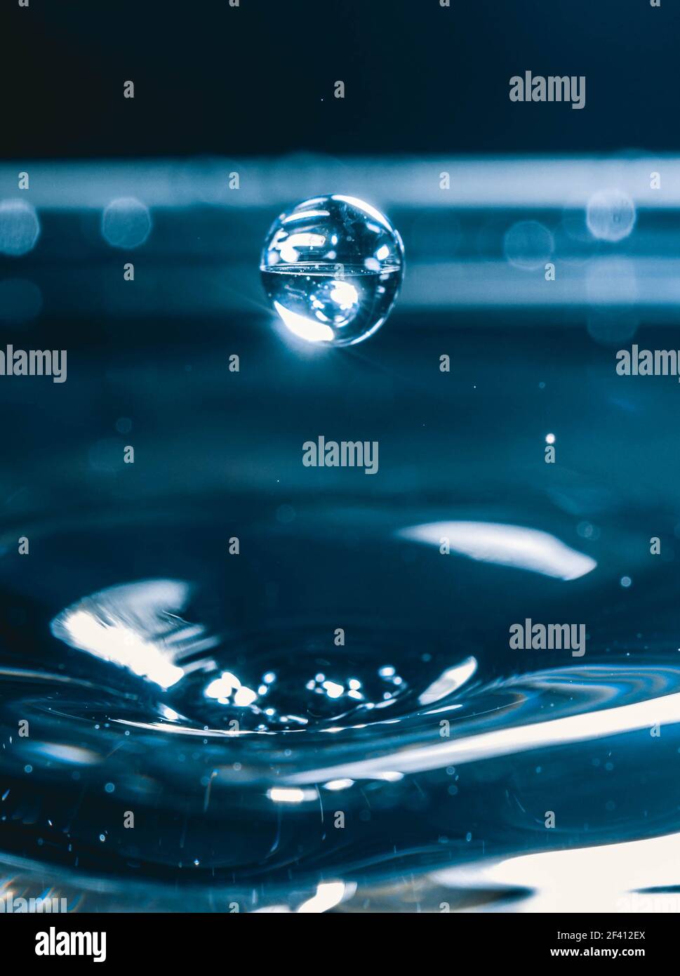 Colored water drop, circle ripples, splash of water, closeup Stock ...