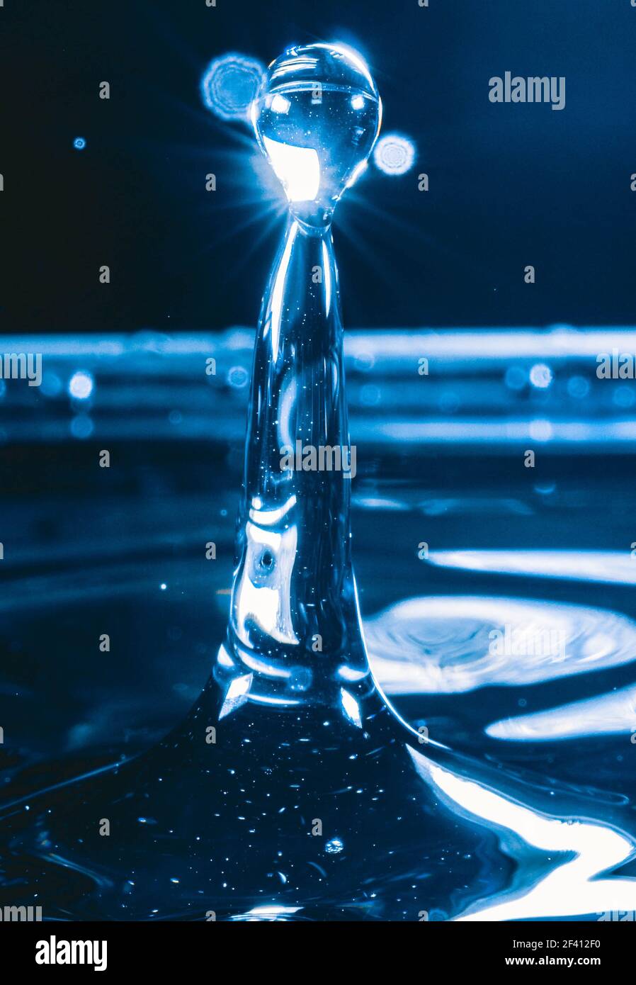 Colored water drop, circle ripples, splash of water, closeup Stock ...