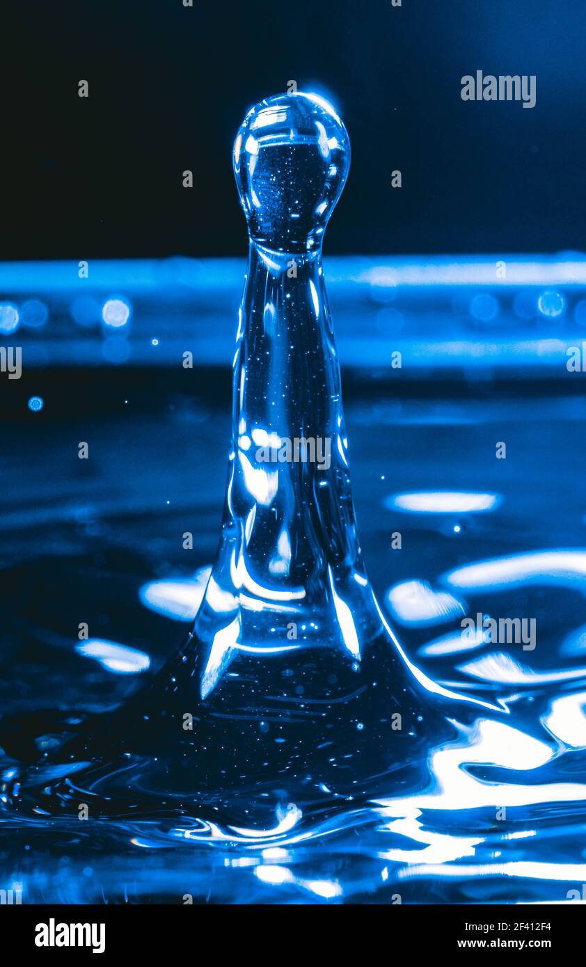 Colored water drop, circle ripples, splash of water, closeup Stock ...