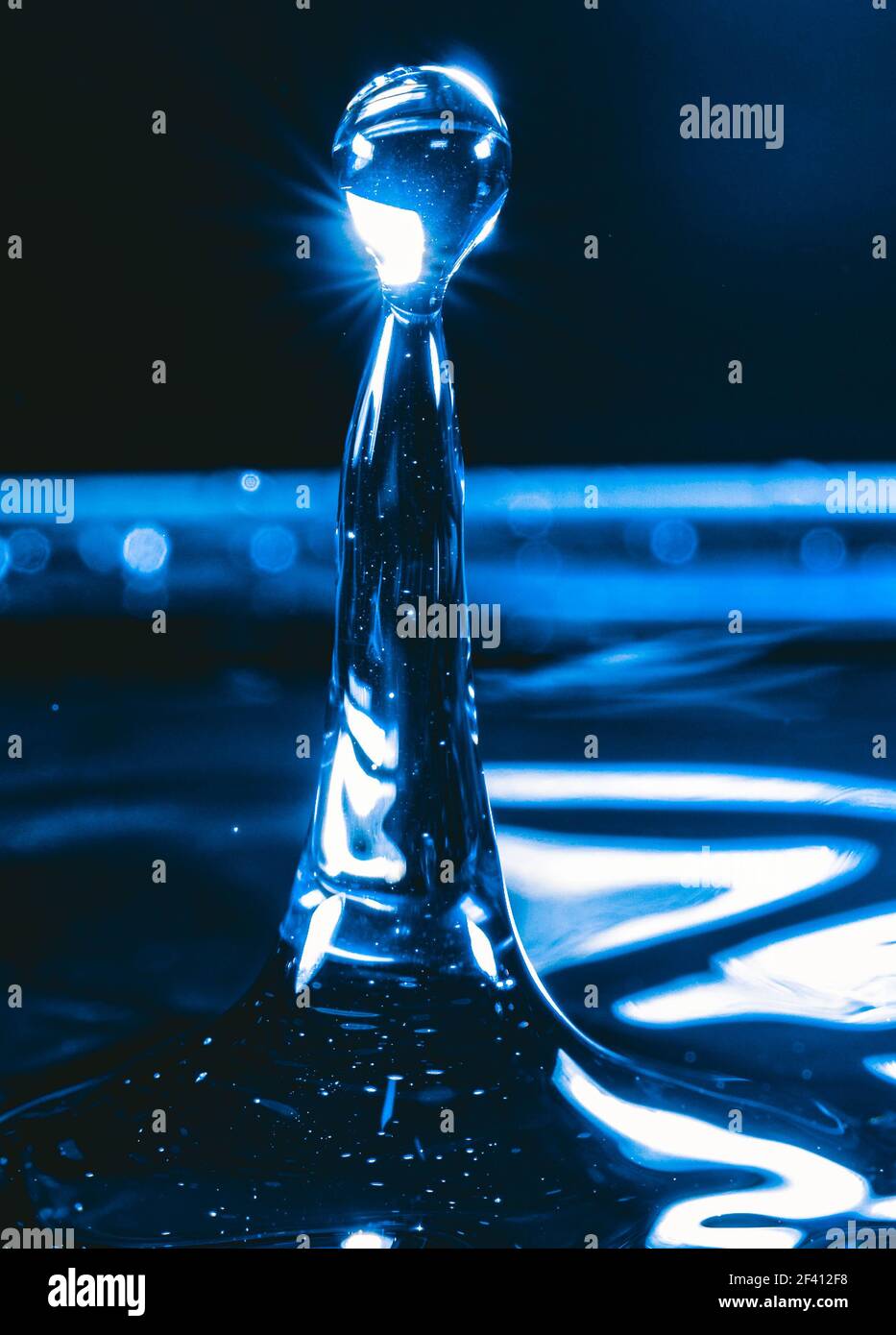 Colored water drop, circle ripples, splash of water, closeup Stock ...