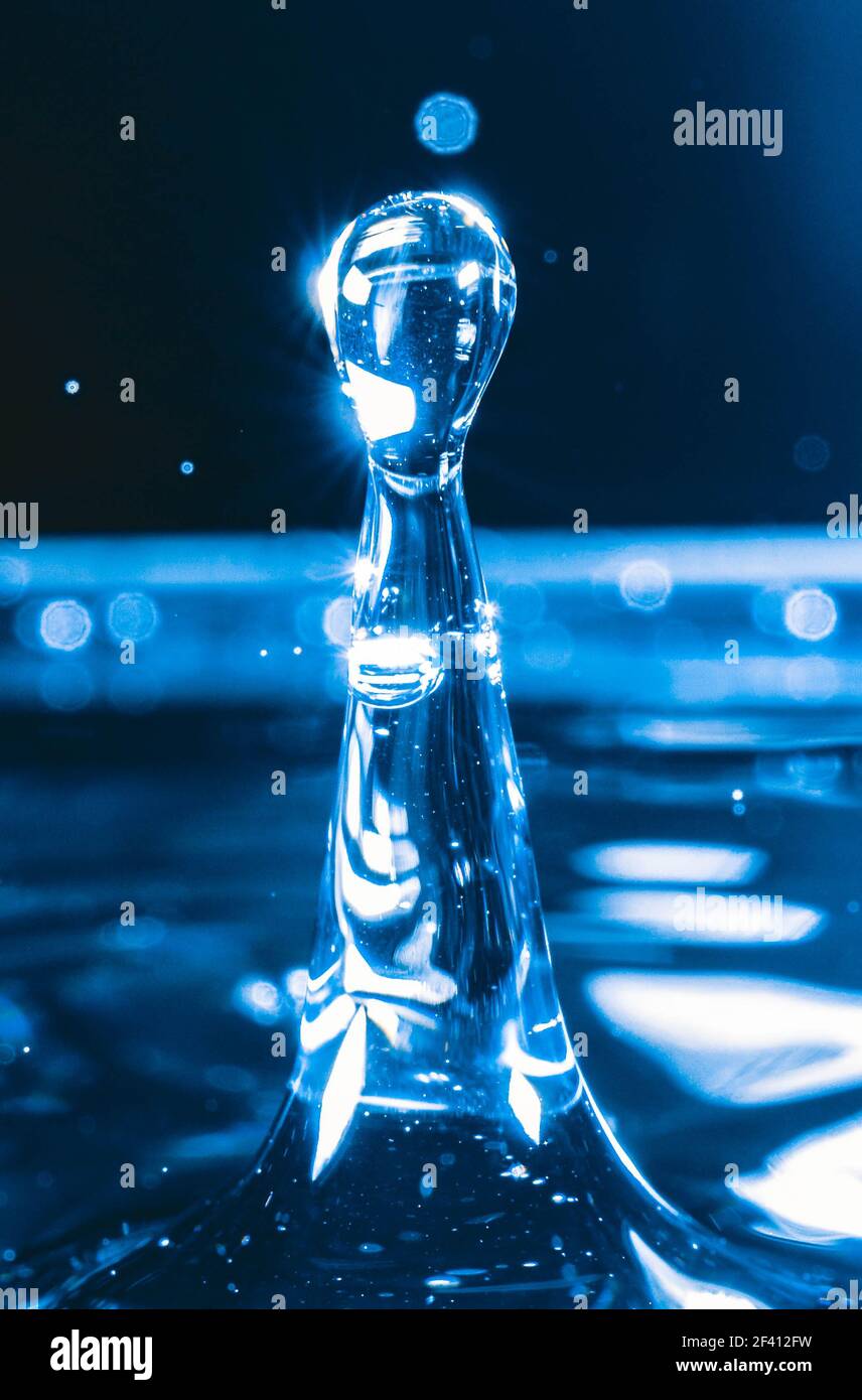 Colored water drop, circle ripples, splash of water, closeup Stock ...