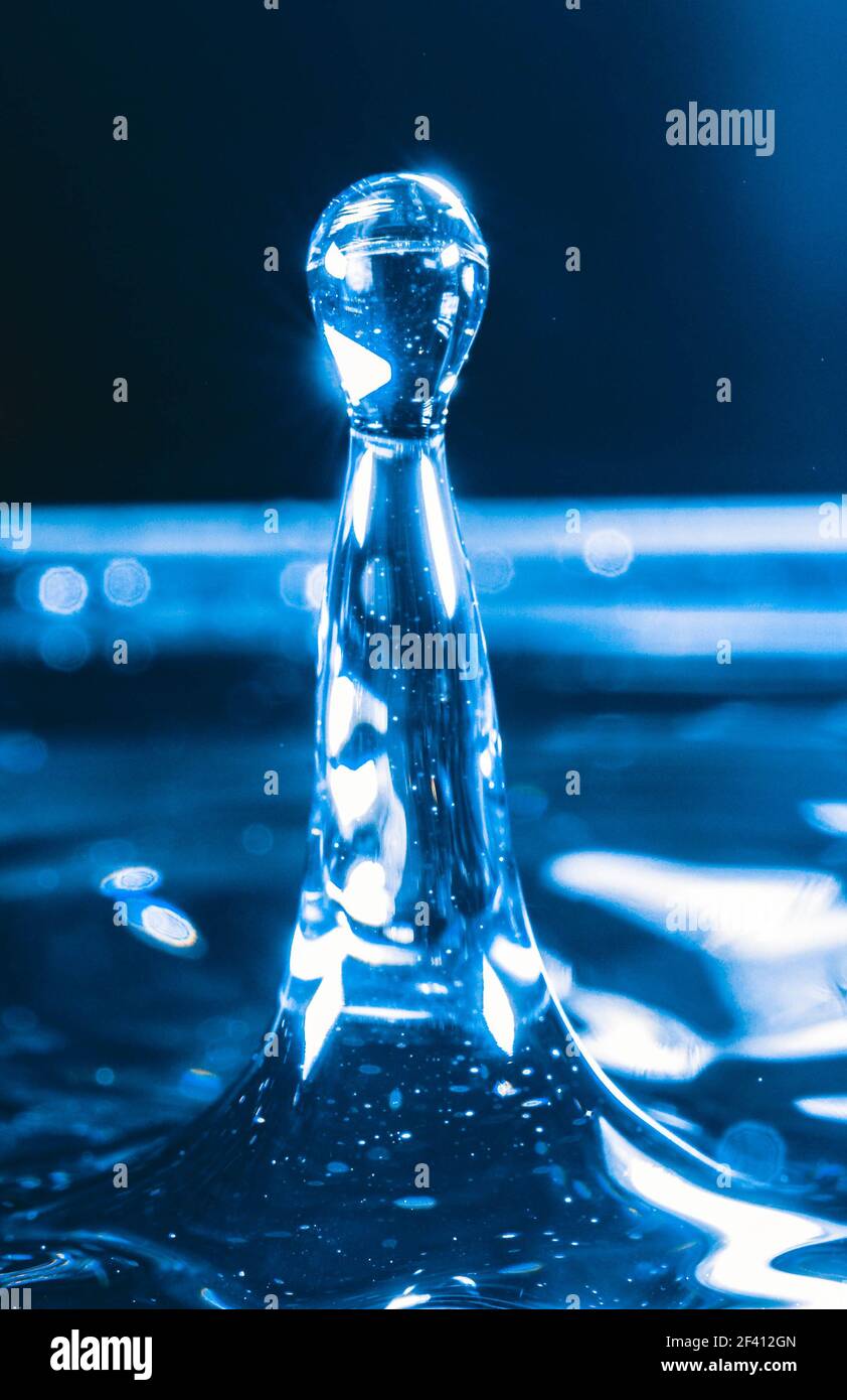 Colored water drop, circle ripples, splash of water, closeup Stock ...