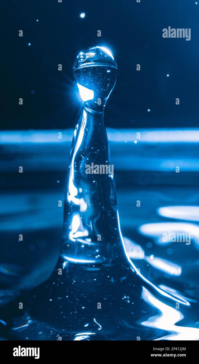 Colored water drop, circle ripples, splash of water, closeup Stock ...