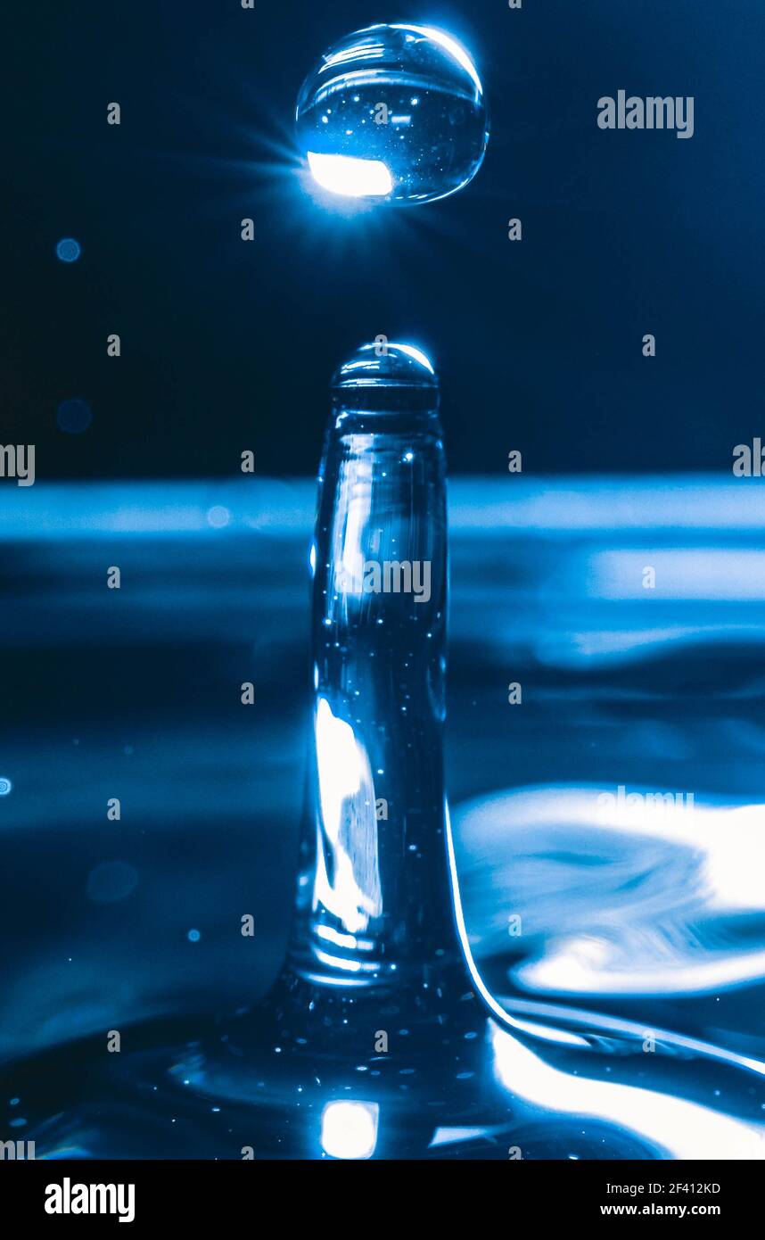 Colored water drop, circle ripples, splash of water, closeup Stock ...