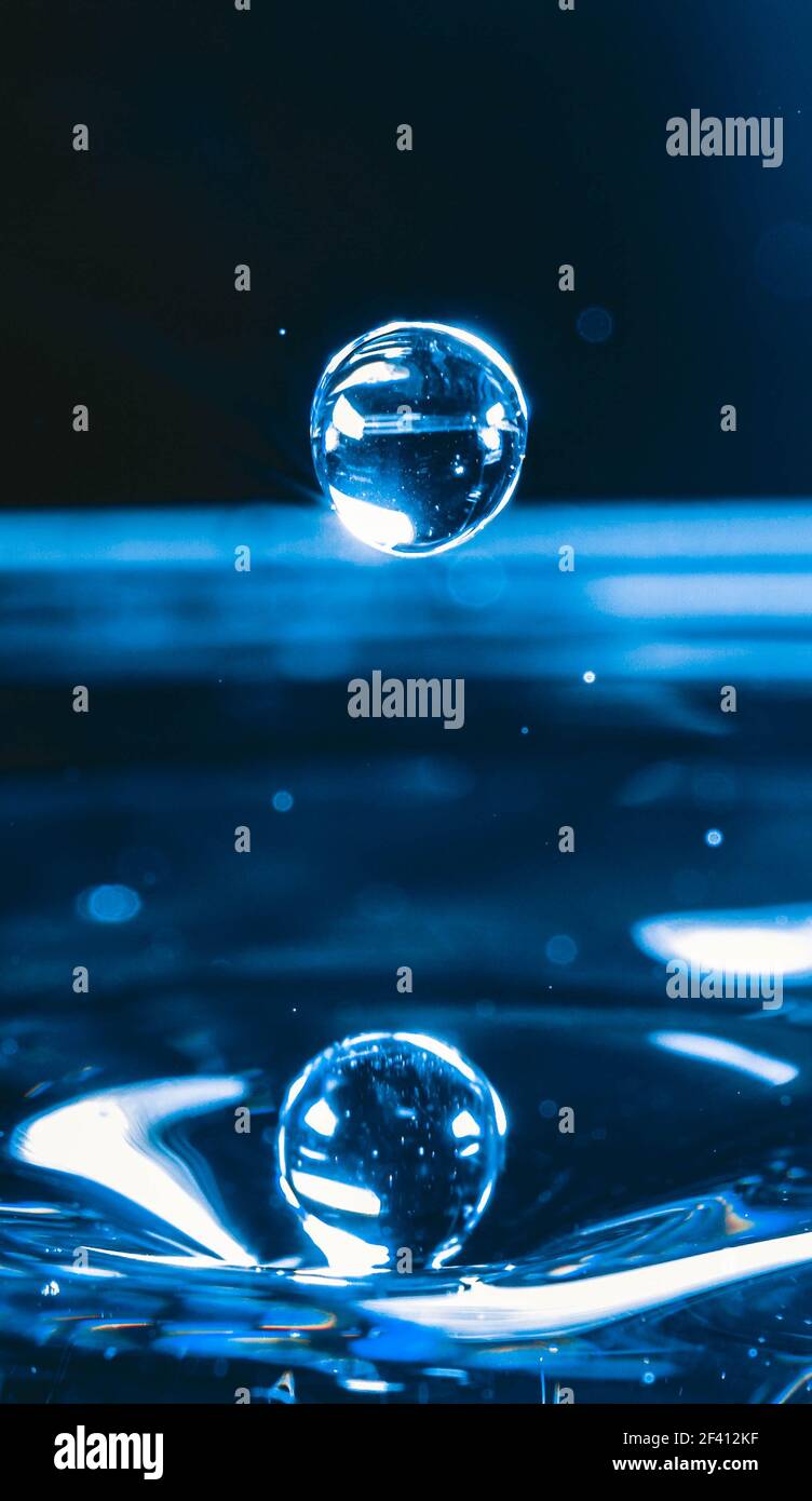 Colored water drop, circle ripples, splash of water, closeup Stock ...