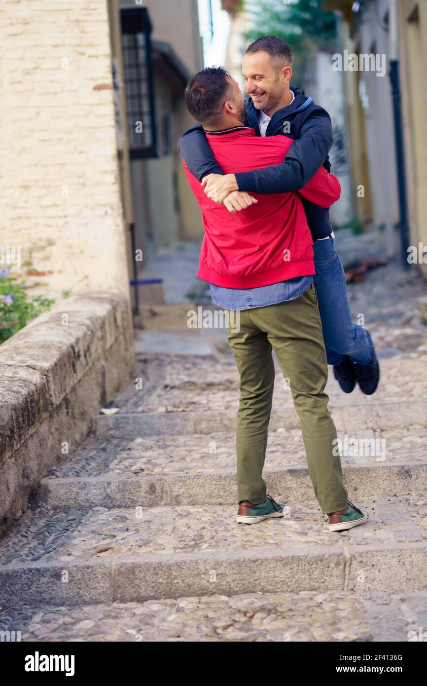 Gay couple in a fun and romantic moment in the street. Homosexual ...