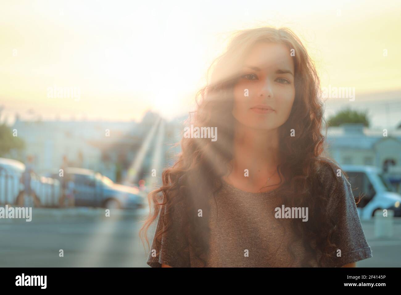 Soft Focus blurry portrait of cute woman in sunset sunrays backlit ...