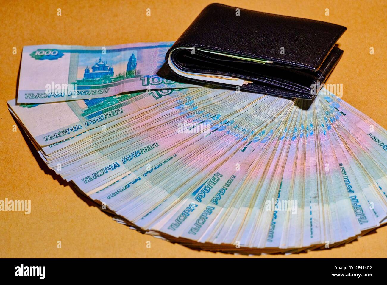 Fun of Russian Money Rubles in a leather wallet on craft paper ...