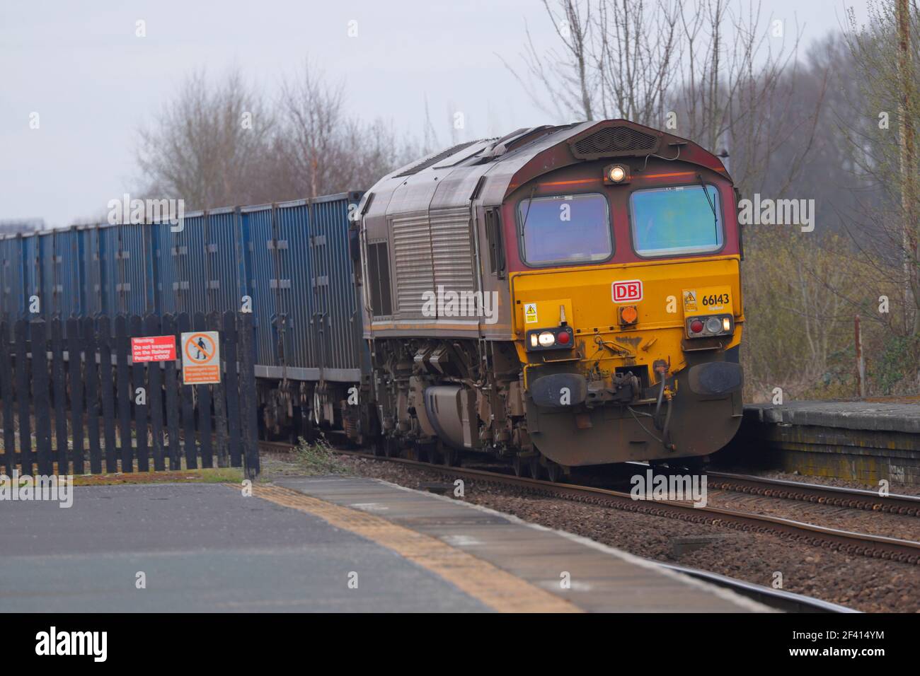 A Rail Class 66 freight train operated by EWS running through Church ...