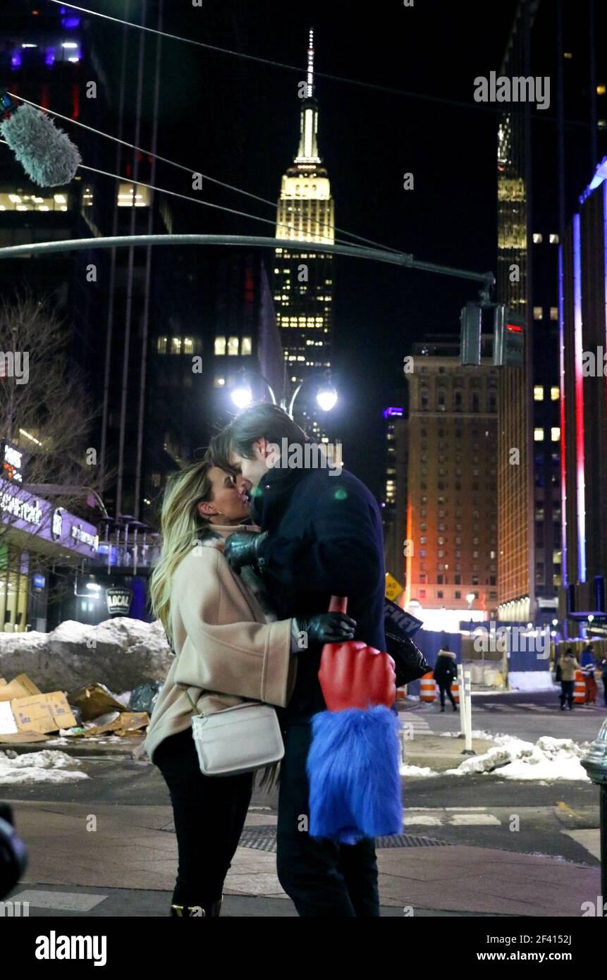 New York - NY - 20210211 Hilary Duff and Steven Good share a kiss while ...