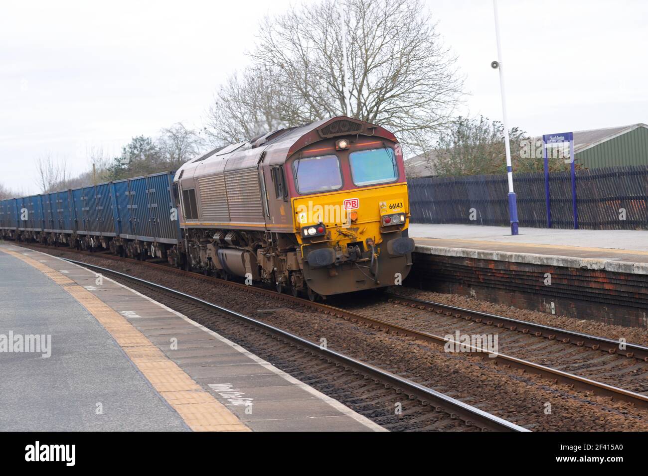 EWS Rail Class 66 freight train passing through Church Fenton Station ...