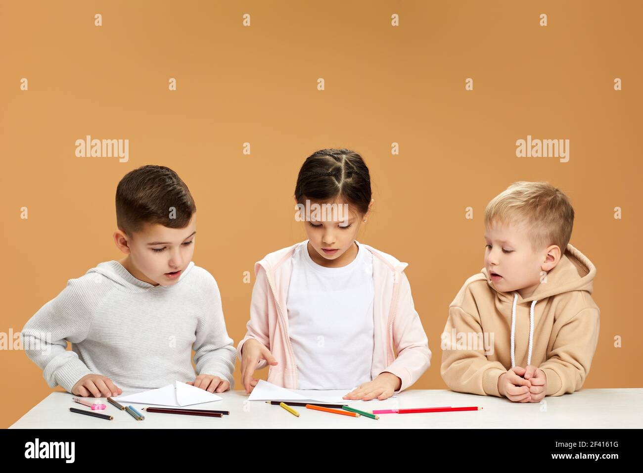 happy children draw together at the table Stock Photo - Alamy