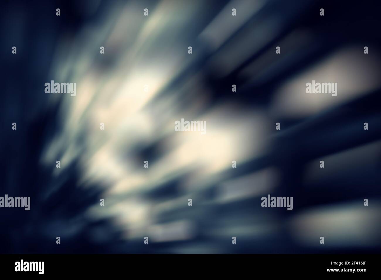 Defocused motion blur spots of light fly on black background ...