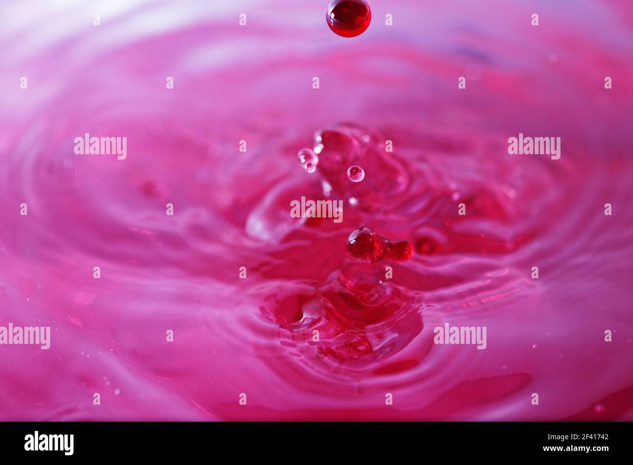Colored water drop, circle ripples, splash of water, closeup Stock ...