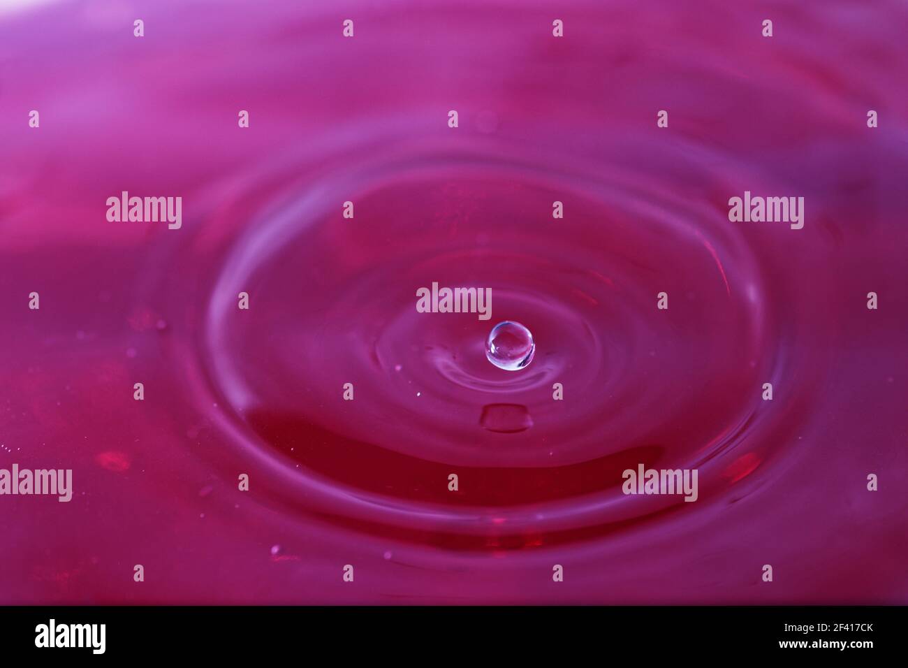 Colored water drop, circle ripples, splash of water, closeup Stock ...