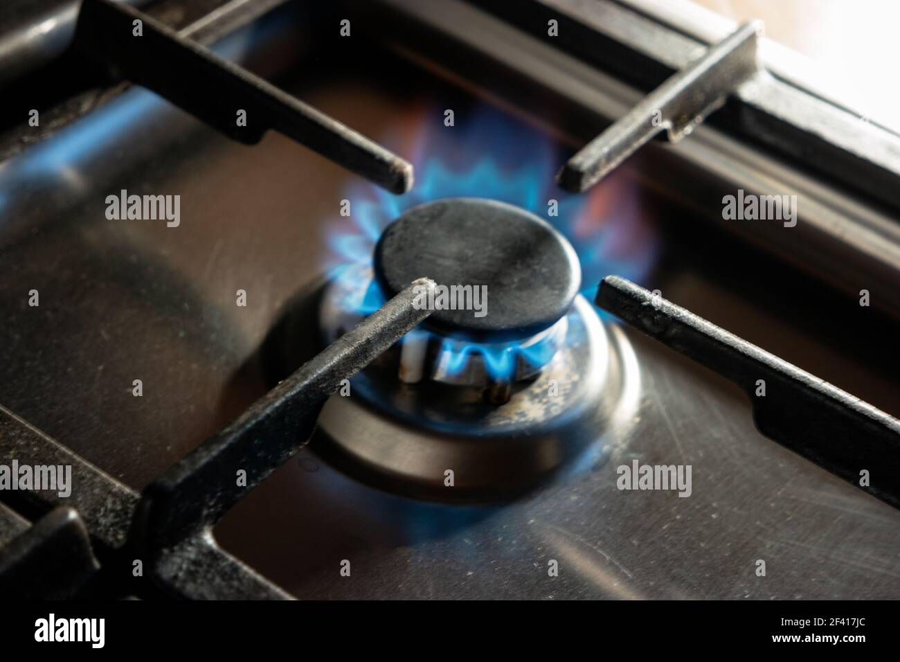 Blue natural gas fire in stove burner Stock Photo - Alamy