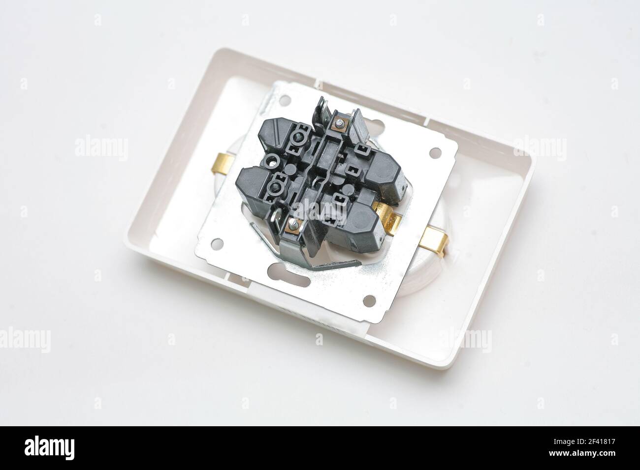 Rear view of electric outlet on white background. Rear view of electric ...