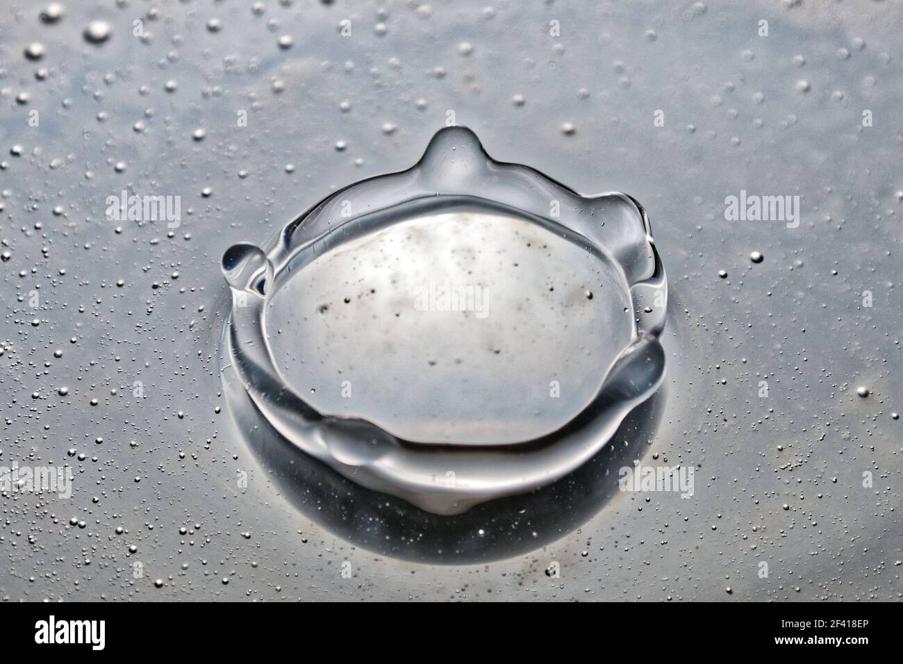 Colored water drop, circle ripples, splash of water, closeup Stock ...