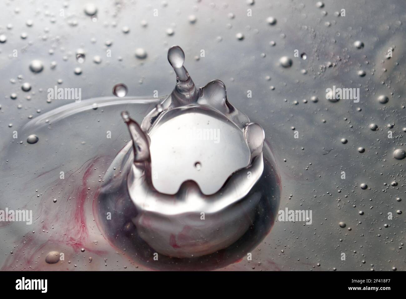 Colored water drop, circle ripples, splash of water, closeup Stock ...