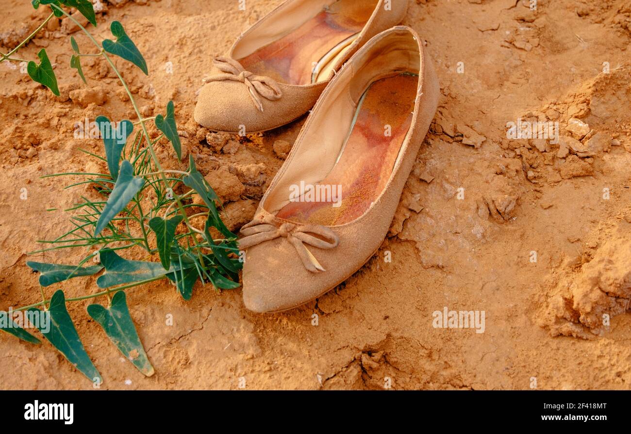 Shoes on dirt Stock Photo - Alamy