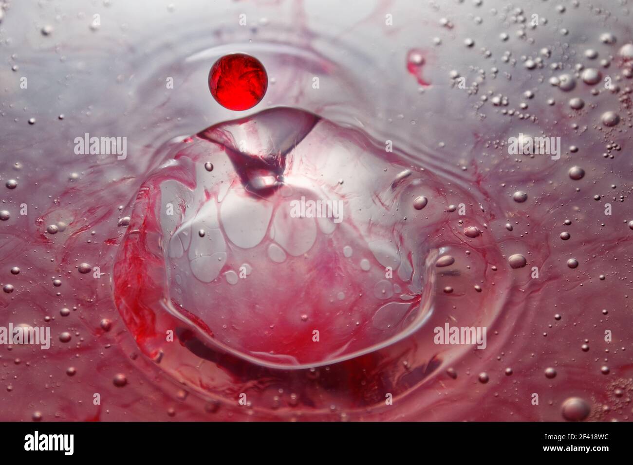 Colored water drop, circle ripples, splash of water, closeup Stock ...