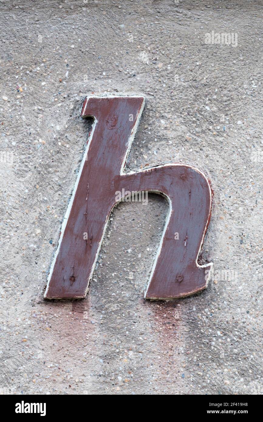 Historical letter h of an advertising typeface in red-brown Stock Photo ...