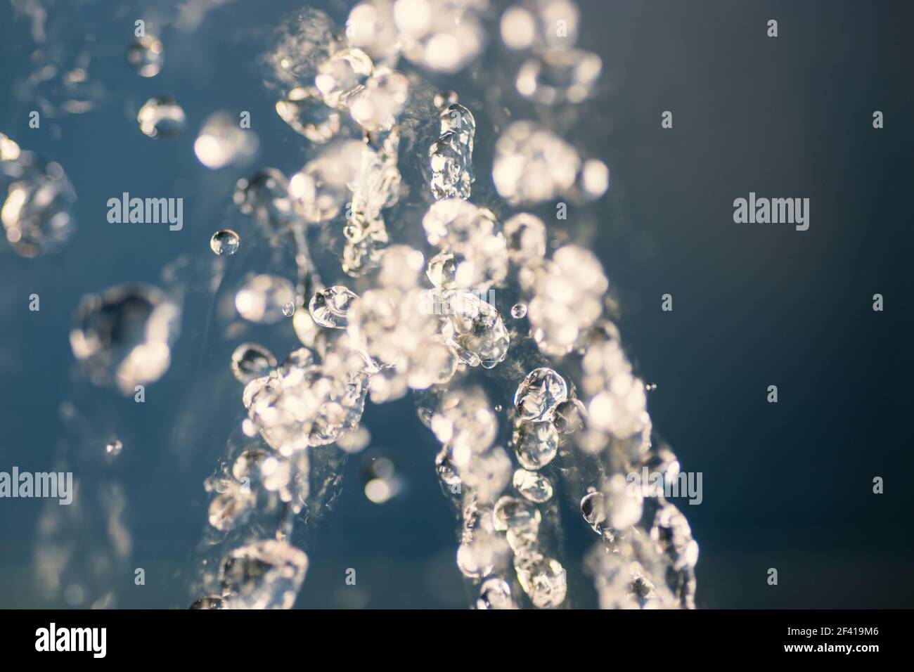Drops of water fly in air, copyspace on the right Stock Photo - Alamy