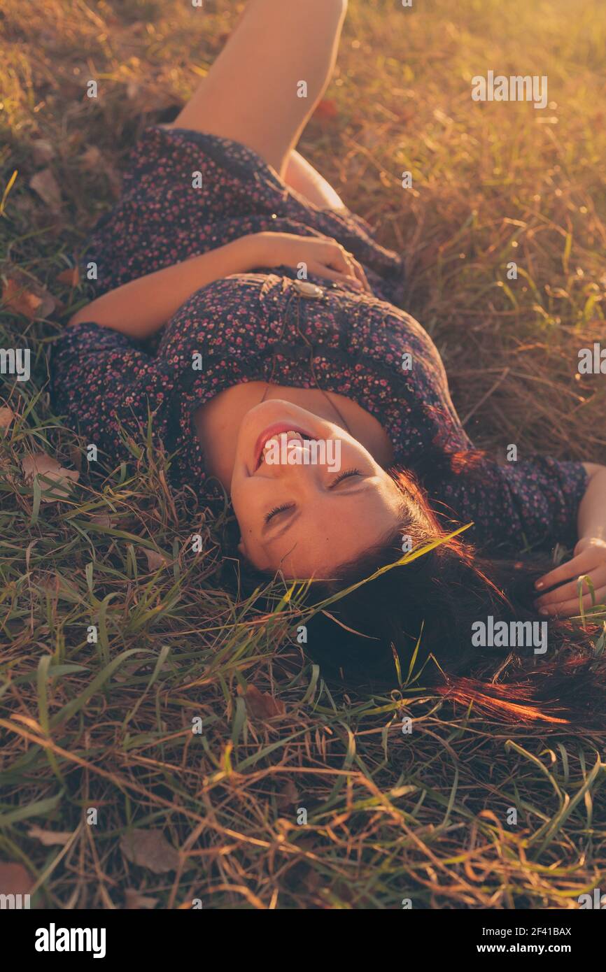 Teen girl lying in field hi-res stock photography and images - Alamy