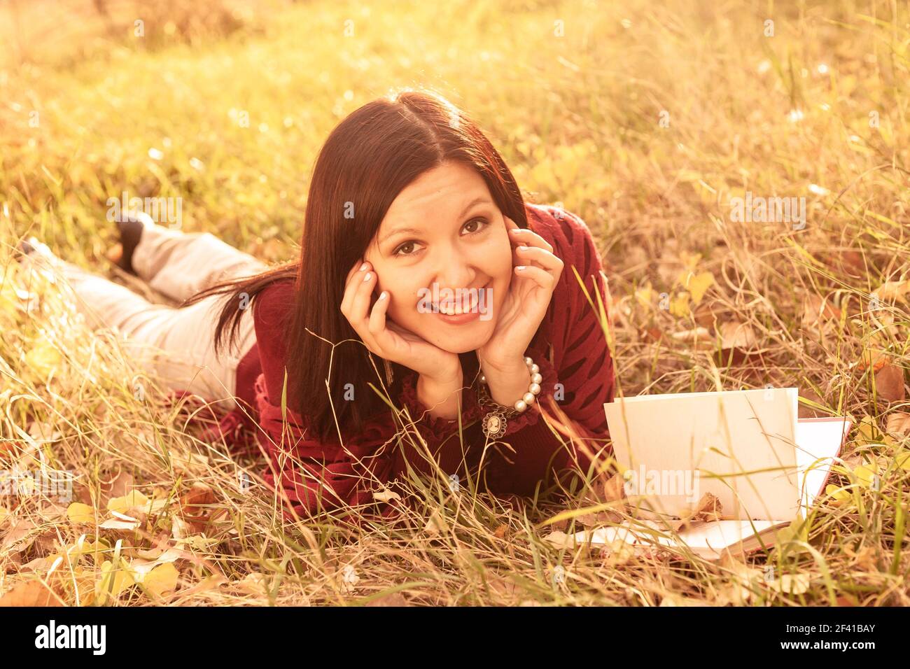 Teen girl lying in field hi-res stock photography and images - Alamy