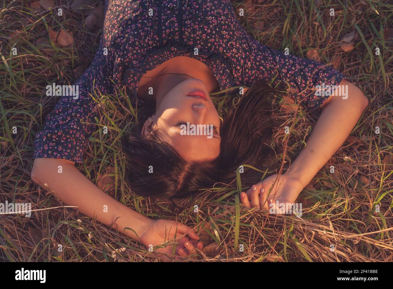 Teen girl lying in field hi-res stock photography and images - Alamy