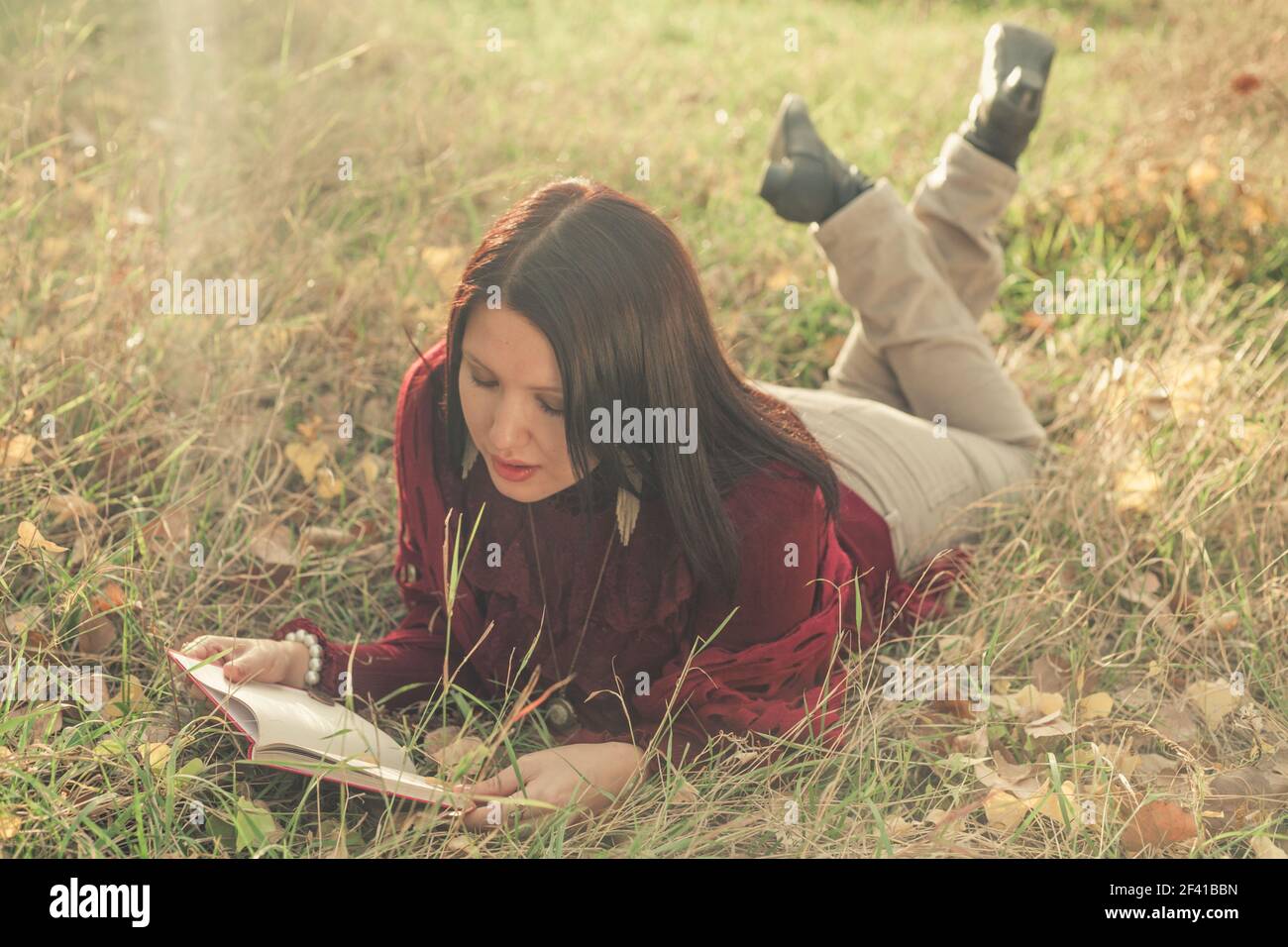Teen girl lying in field hi-res stock photography and images - Alamy