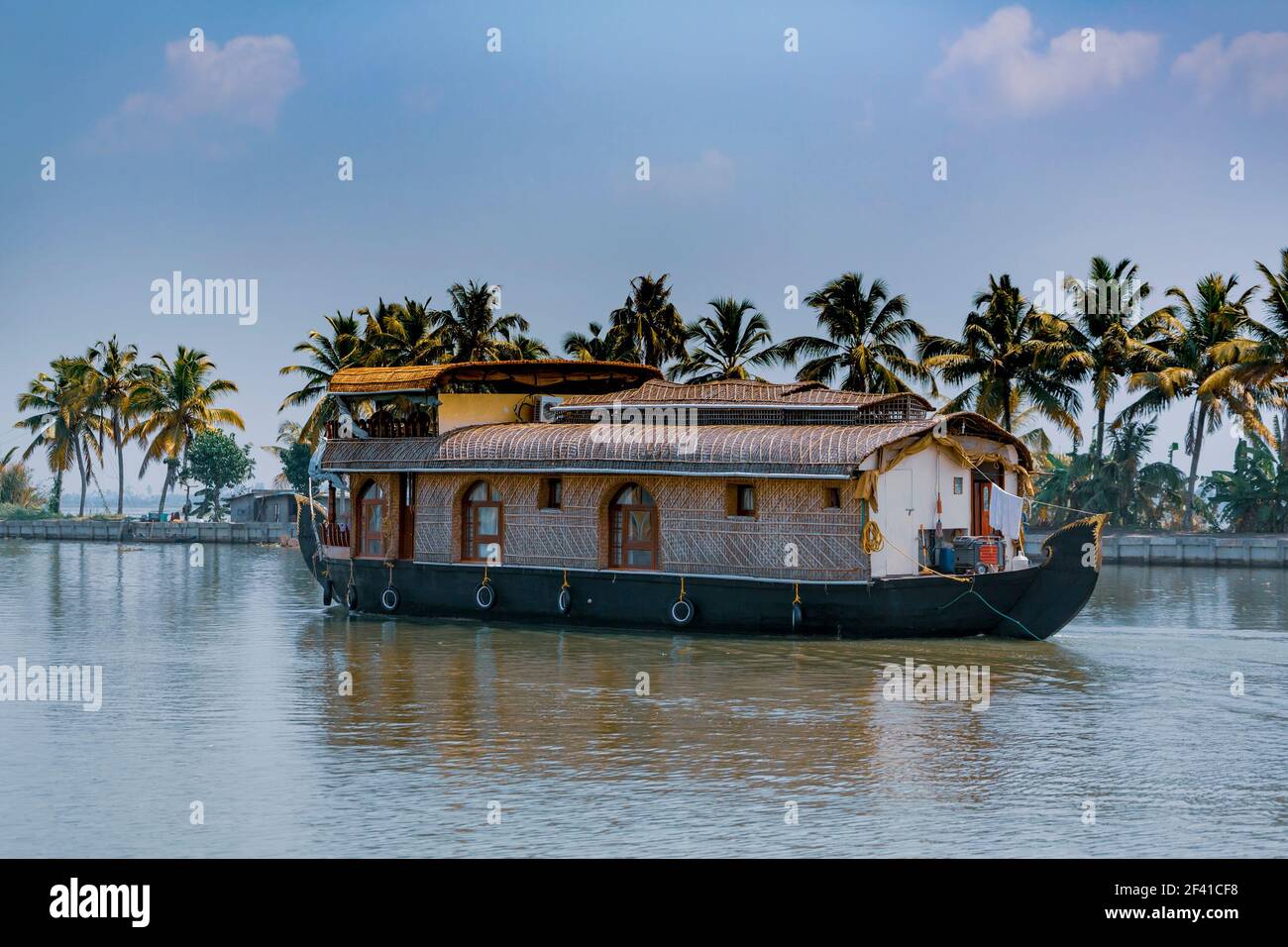 House boat sailing through Kerala backwaters Stock Photo - Alamy