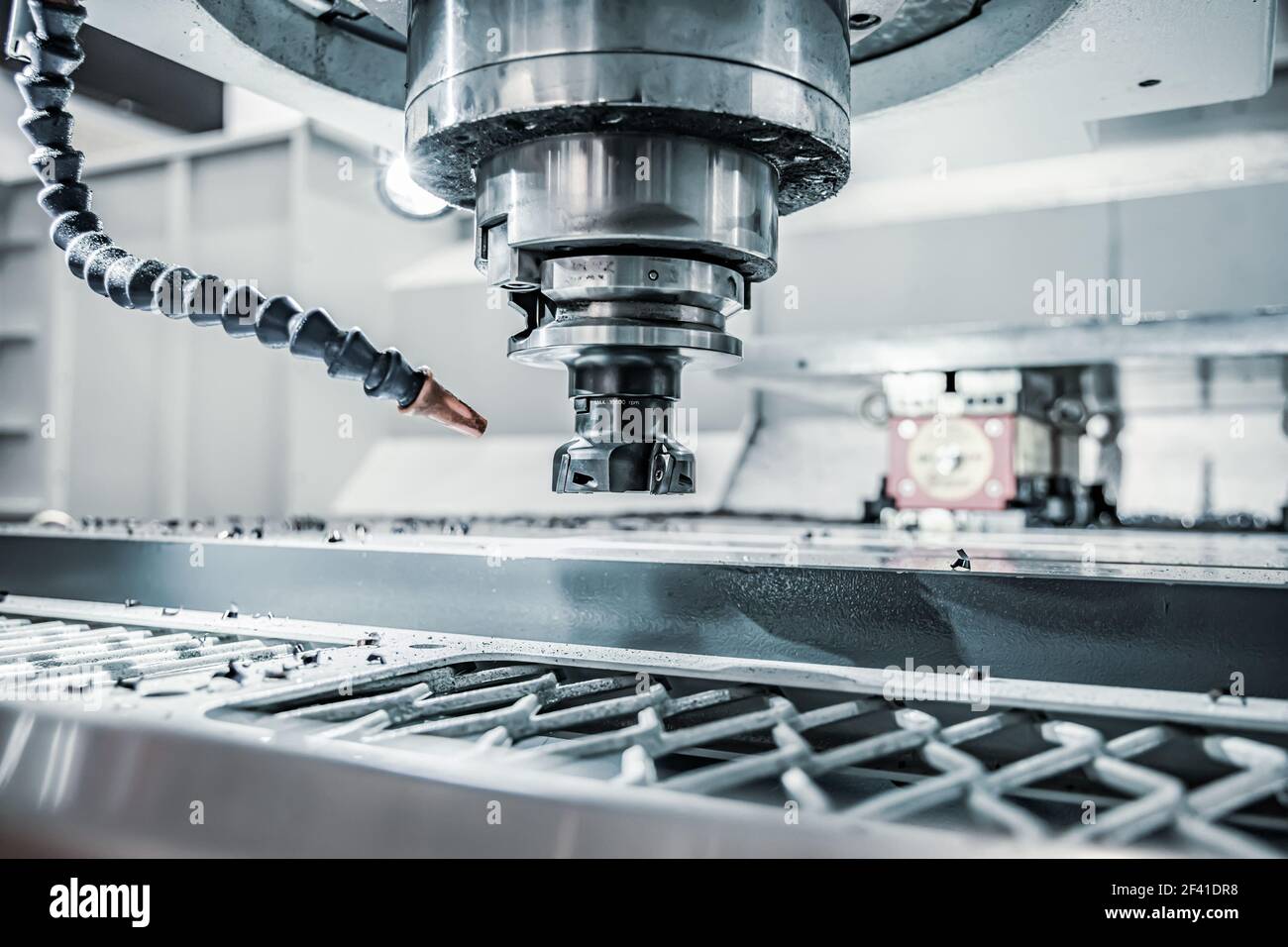 Metalworking CNC lathe milling machine. Cutting metal modern processing technology. Milling is ...