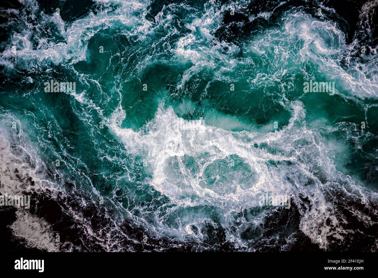 Waves of water of the river and the sea meet each other during high ...