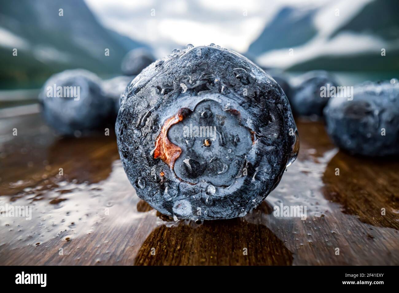 Blueberry antioxidants on a wooden table on a background of Norwegian ...