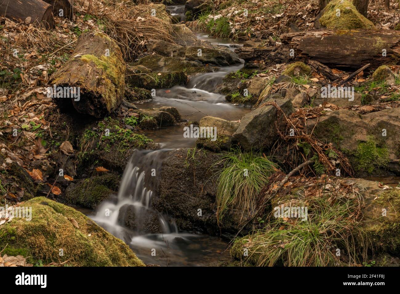 Small creek with waterfall near Vltava river in valley north from ...