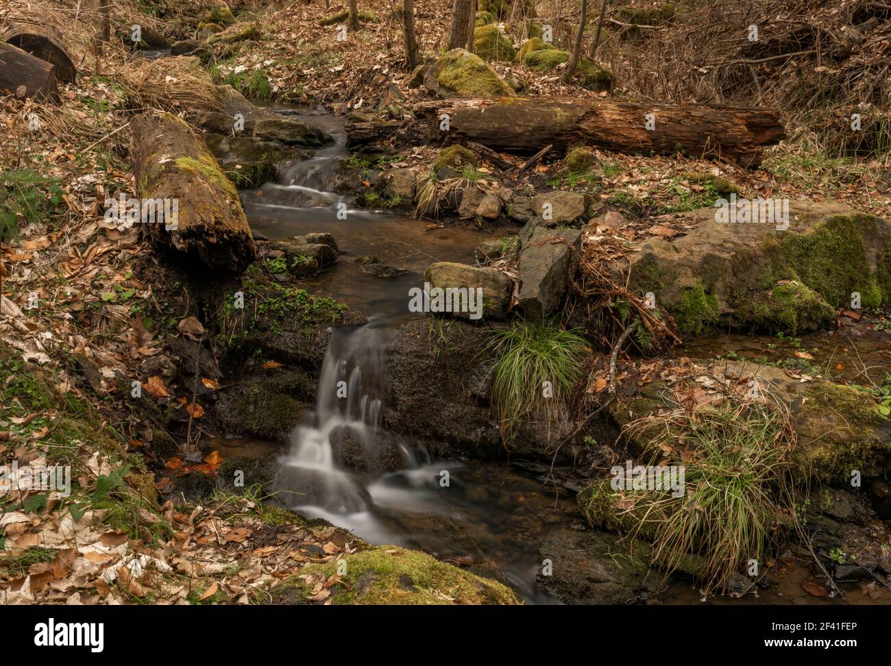 Small creek with waterfall near Vltava river in valley north from ...