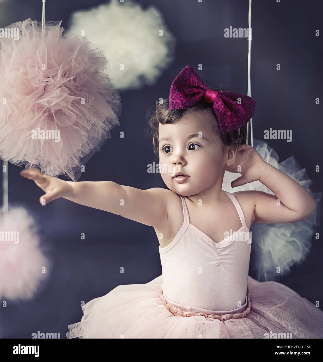 Portrait of a beautiful baby wearing a red polish ribbon Stock Photo ...