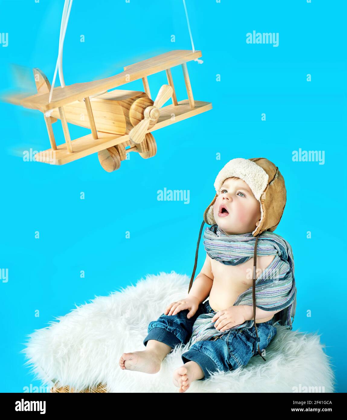 Cute baby boy with an vintage toy airplane Stock Photo - Alamy