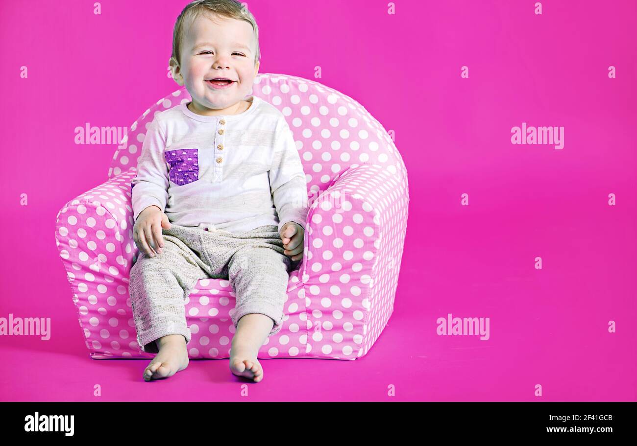 Little cute boy in the pink area Stock Photo - Alamy