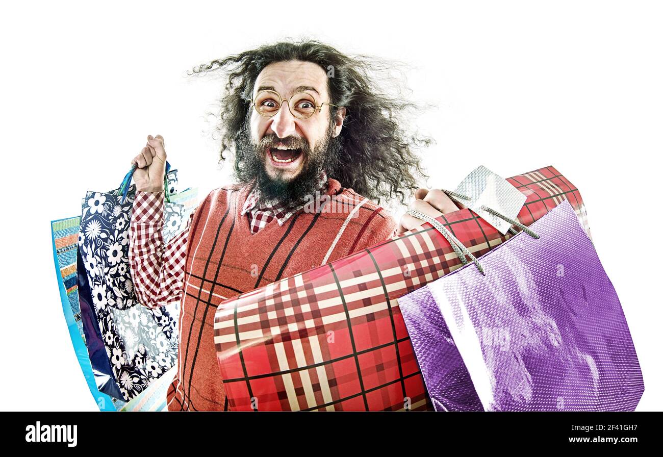Funny young nerd holding many shopping bags Stock Photo - Alamy