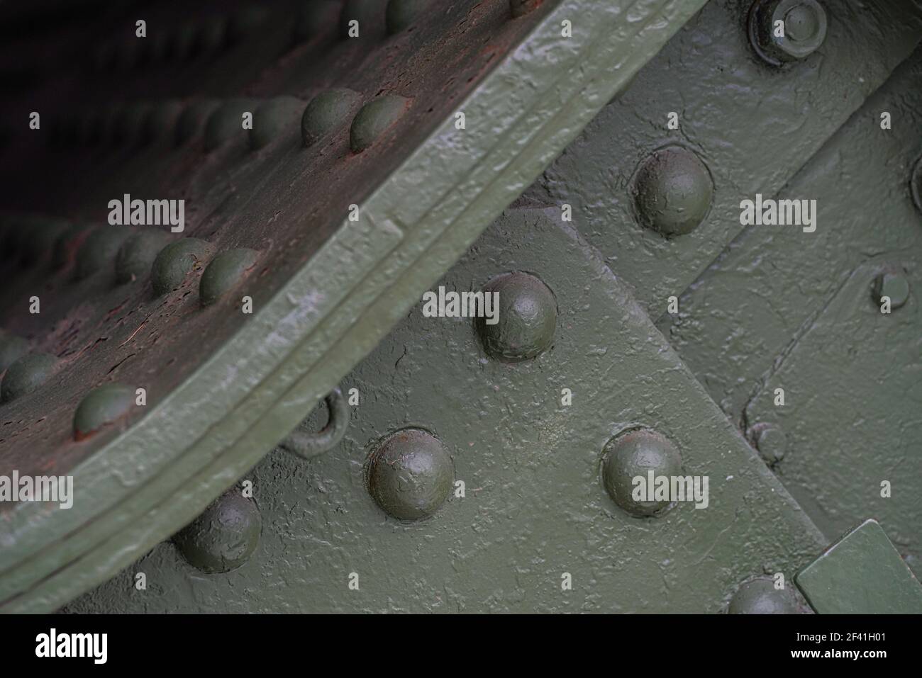 Abstract green industrial metal background texture with bolts and ...