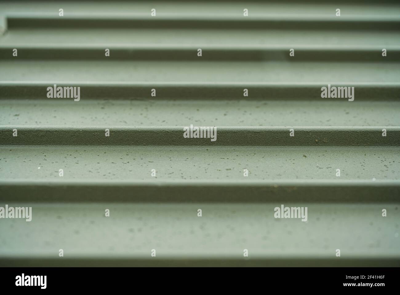 Abstract green industrial metal background texture with bolts and ...