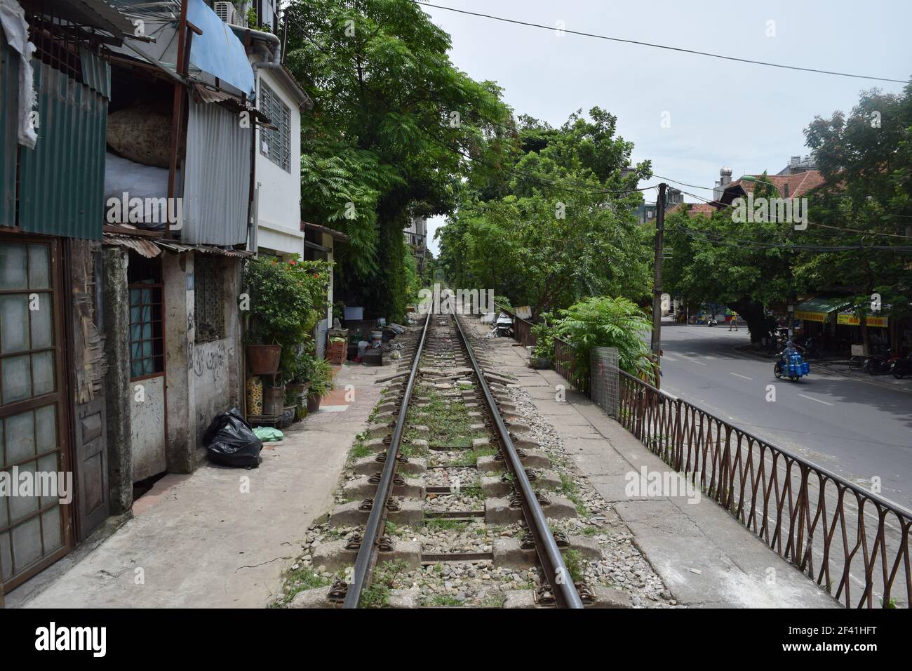 Train track straight trough Hanoi city in Vietnam Stock Photo - Alamy