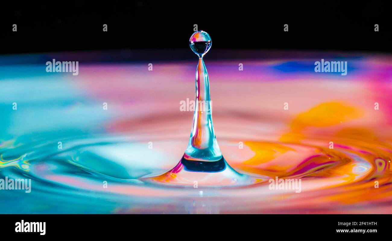 Colored water drop, circle ripples, splash of water, closeup Stock ...