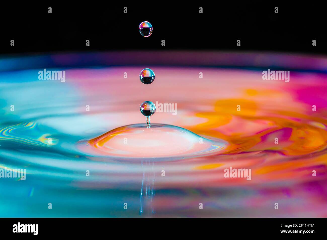 Colored water drop, circle ripples, splash of water, closeup Stock ...