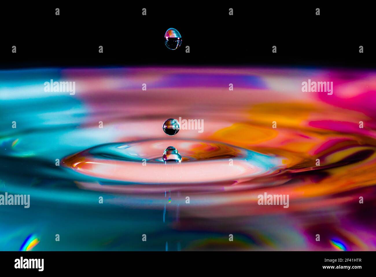 Colored water drop, circle ripples, splash of water, closeup Stock ...