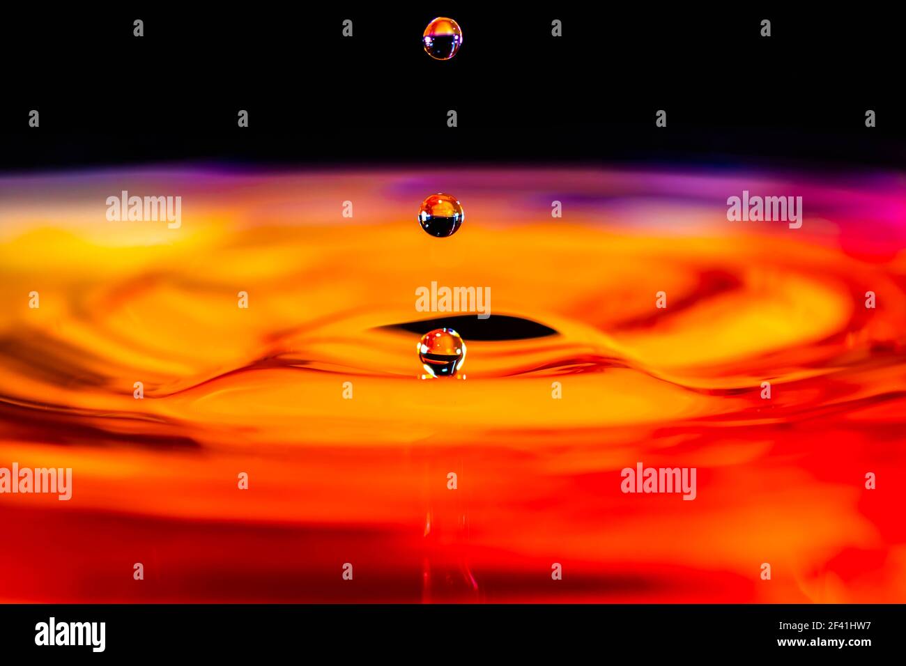 Colored water drop, circle ripples, splash of water, closeup Stock ...